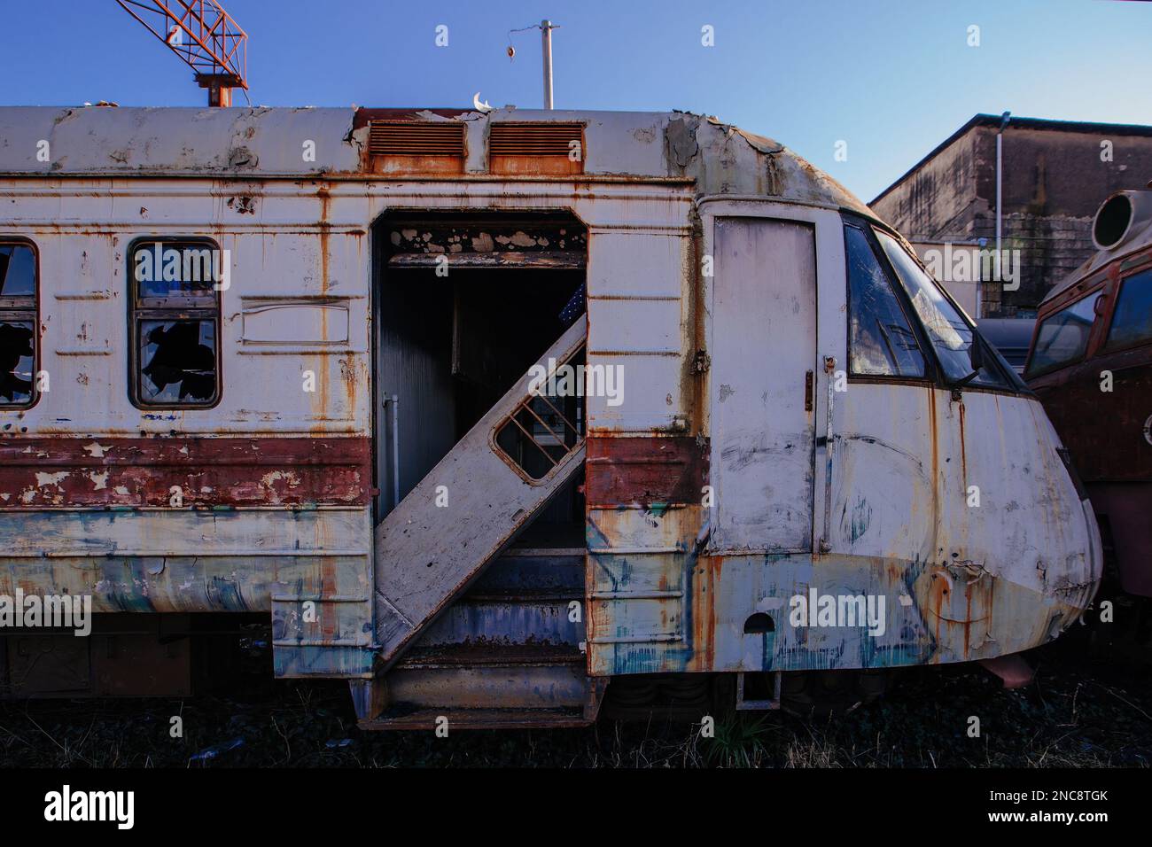 Old abandoned broken high speed train on railway Stock Photo - Alamy