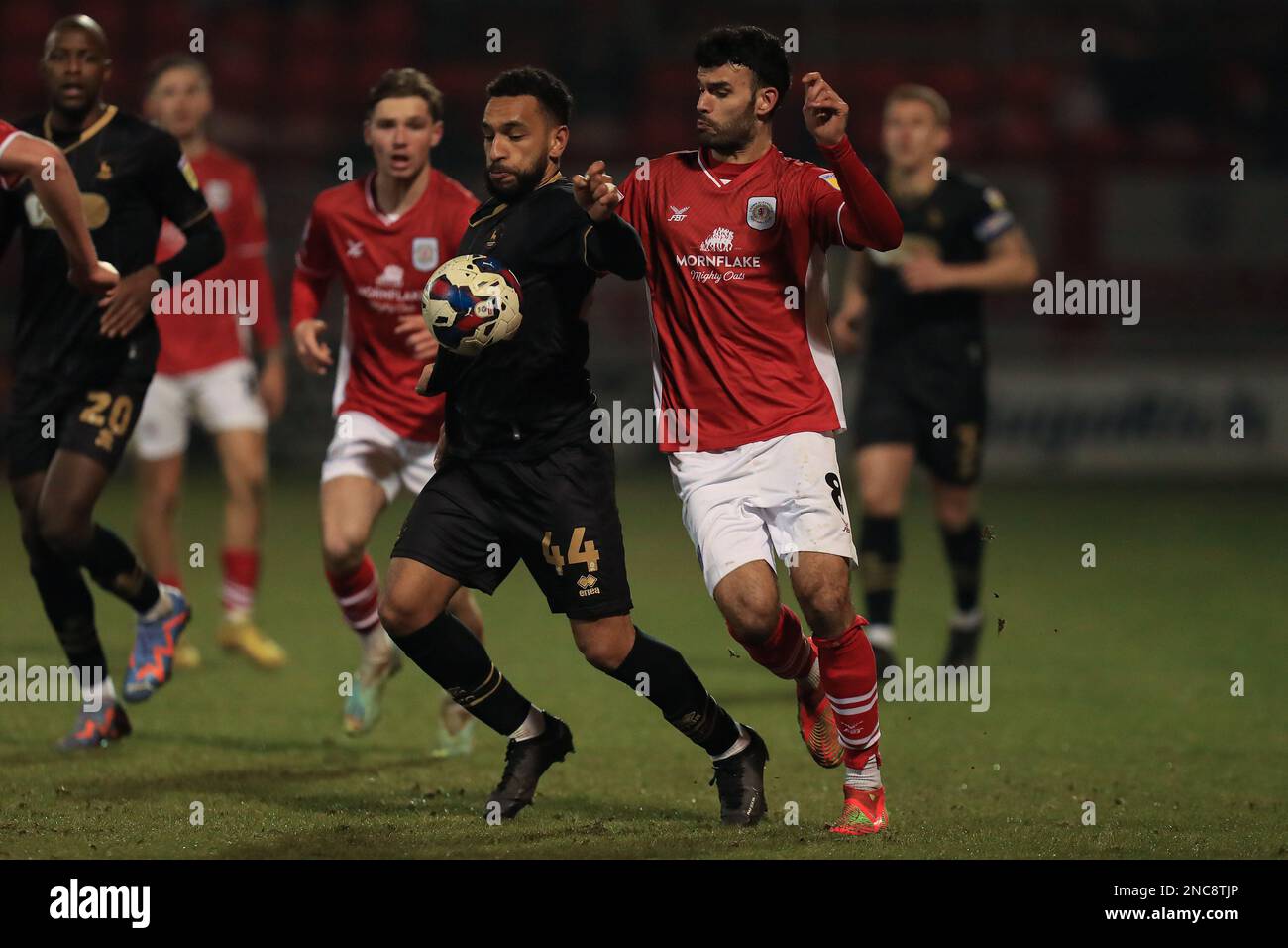 Crewe, UK, 14th February 2023, Hartlepools Brendan Kiernan clashes with ...