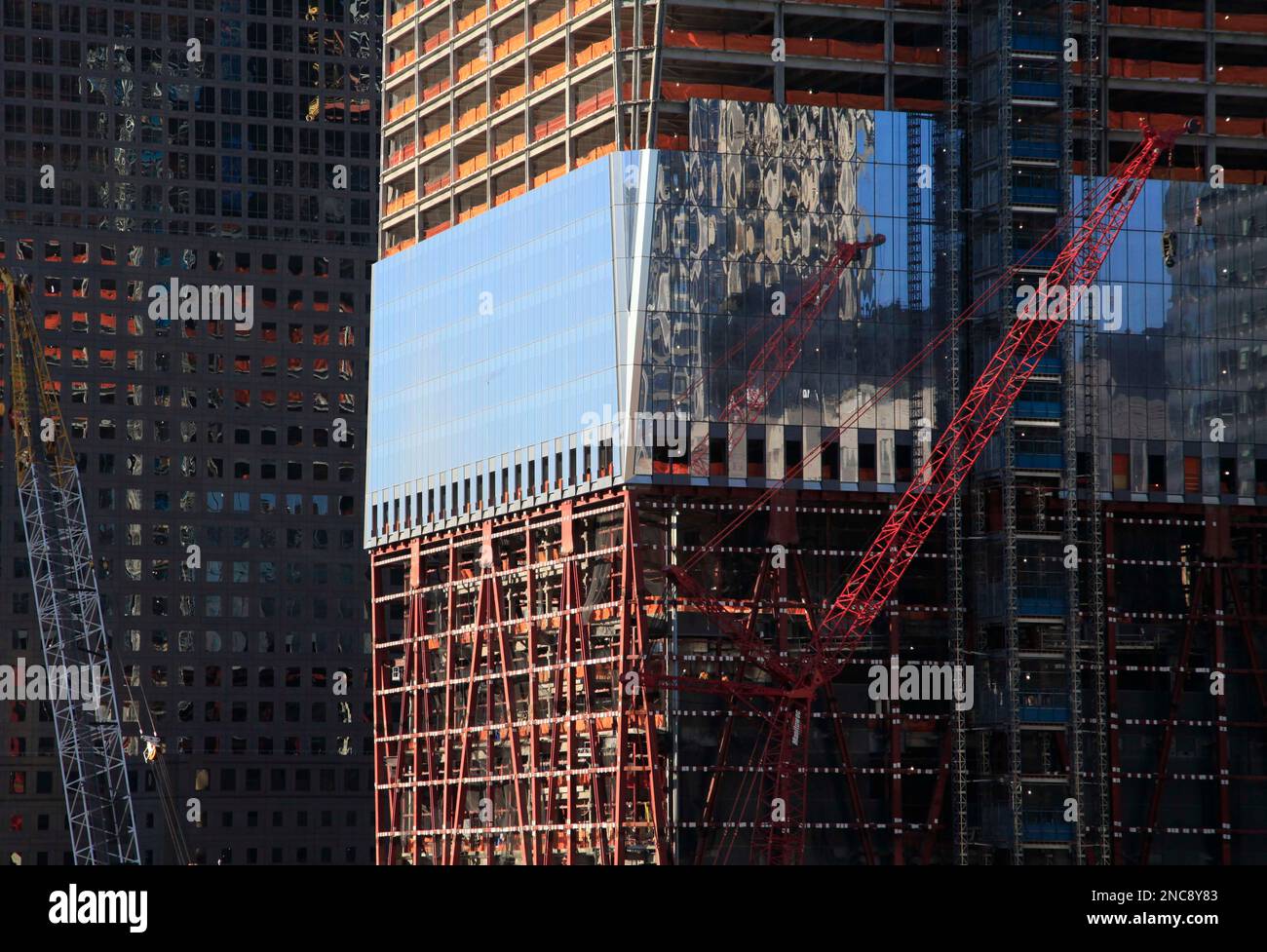 Panels of windows are being installed over the steel framework of One ...