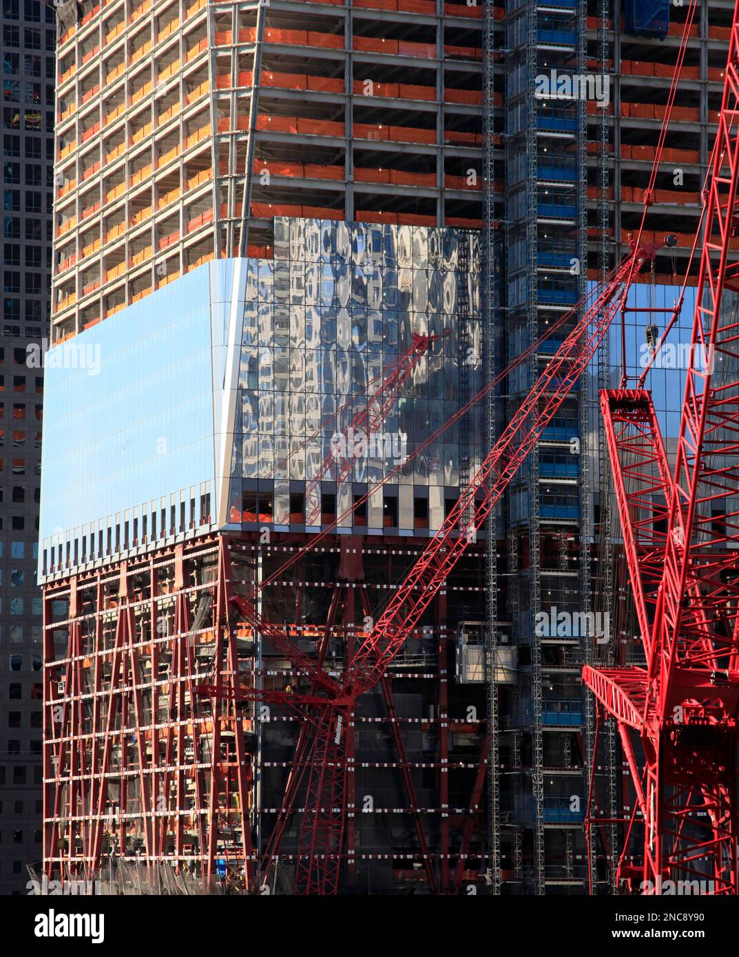 Panels of windows are being installed over the steel framework of One ...