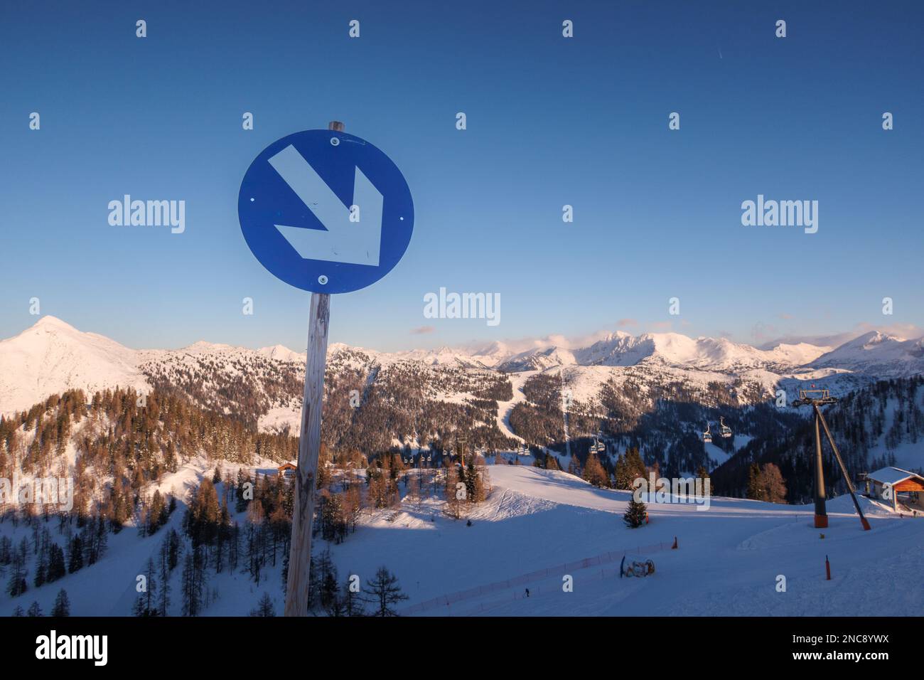 a blue sign marks a blue slope in the ski area Stock Photo - Alamy
