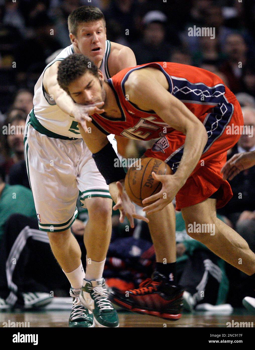 New Jersey Nets center Brook Lopez, front, controls the ball against ...