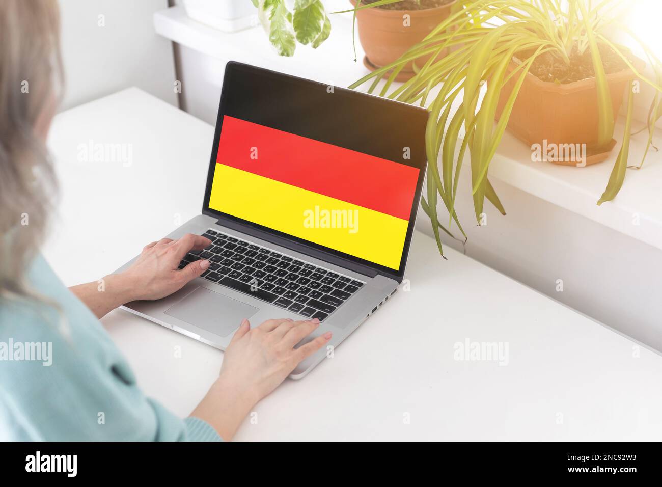 People using laptop and showing on the screen the flag of GERMANY Stock ...