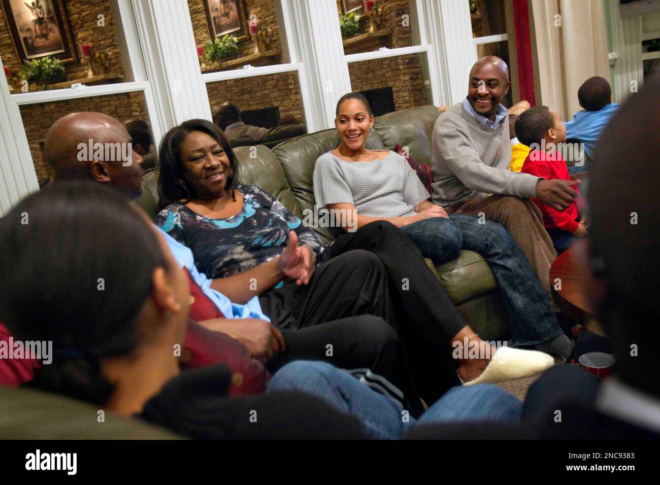 Shelton Haynes, 33, third from right, sits with his wife Tiisha, left ...