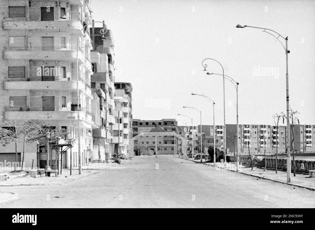 An empty street and buildings give Suez, Egypt, a ghostlike appearance ...