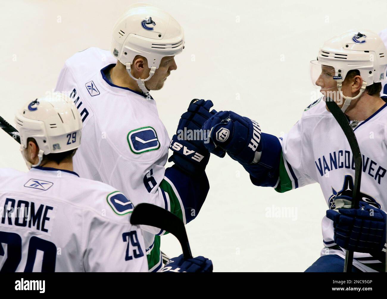 Vancouver Canucks' Sami Salo, left, is congratulated by teammate ...