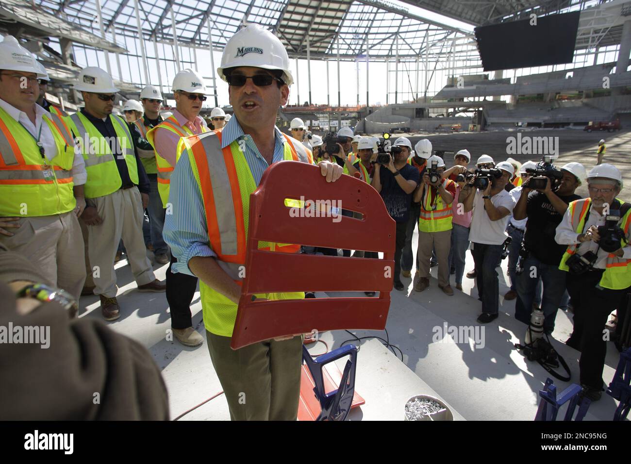 David Samon, the president of the Florida Marlins, displays the first ...