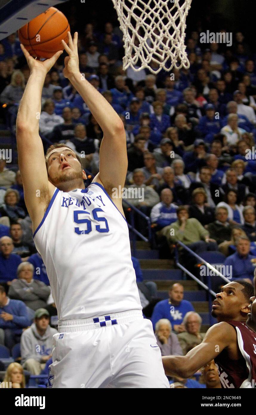 Kentucky's Josh Harrellson shoots next to Mississippi State's Ravern ...