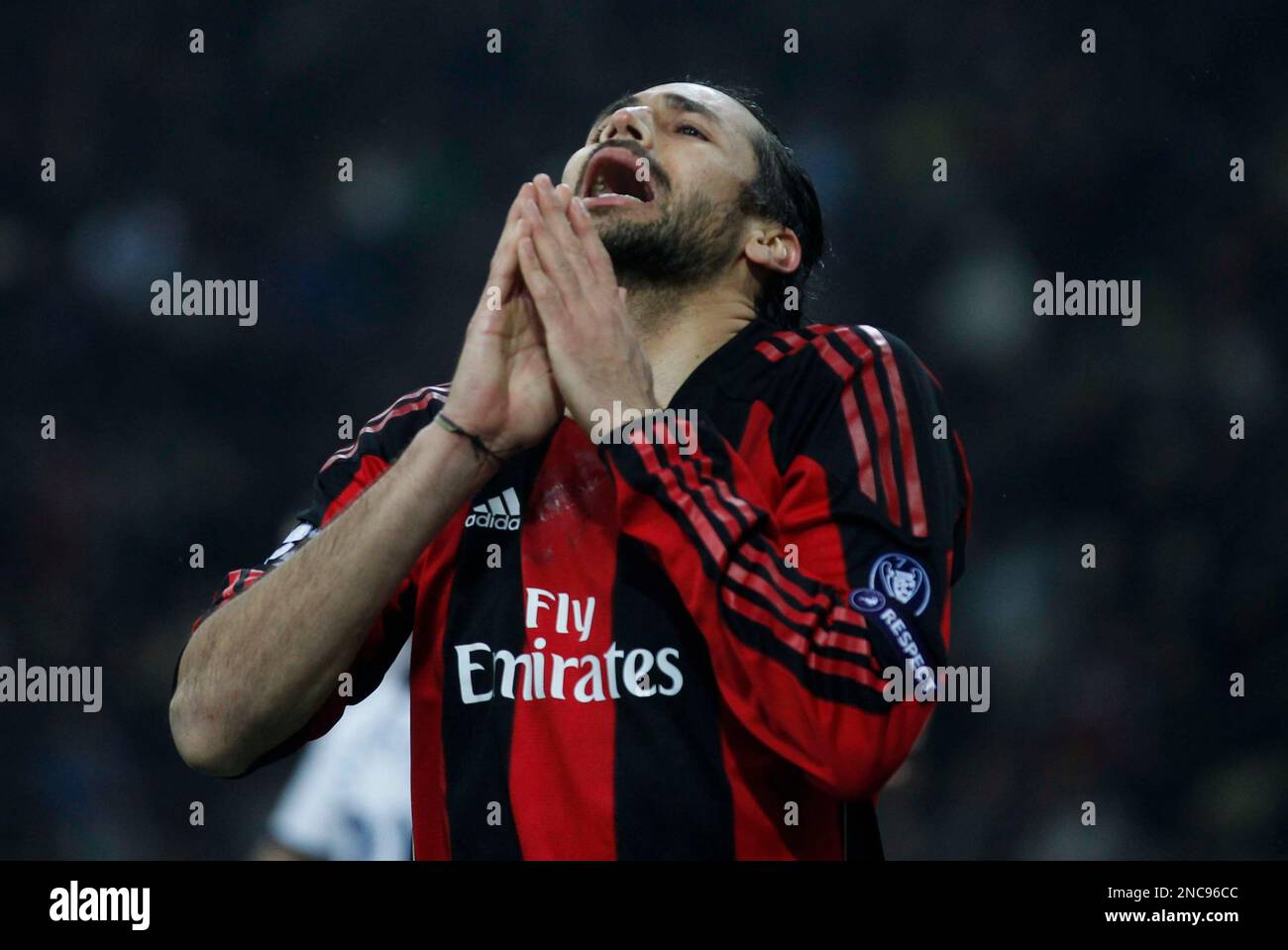 AC Milan defender Mario Yepes, of Colombia, reacts after missing a ...