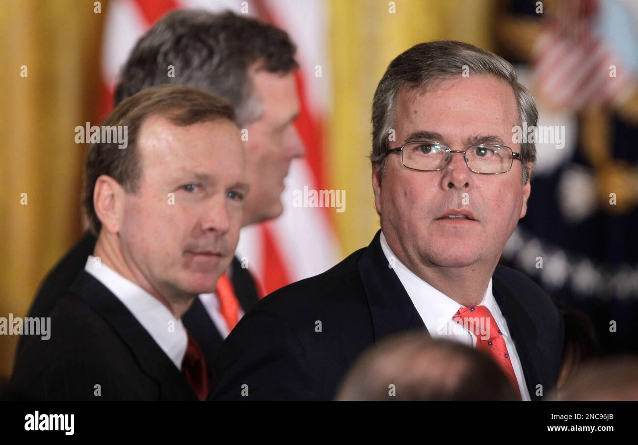 Former Florida Gov. Jeb Bush, right, and his brothers Neil Bush, left ...