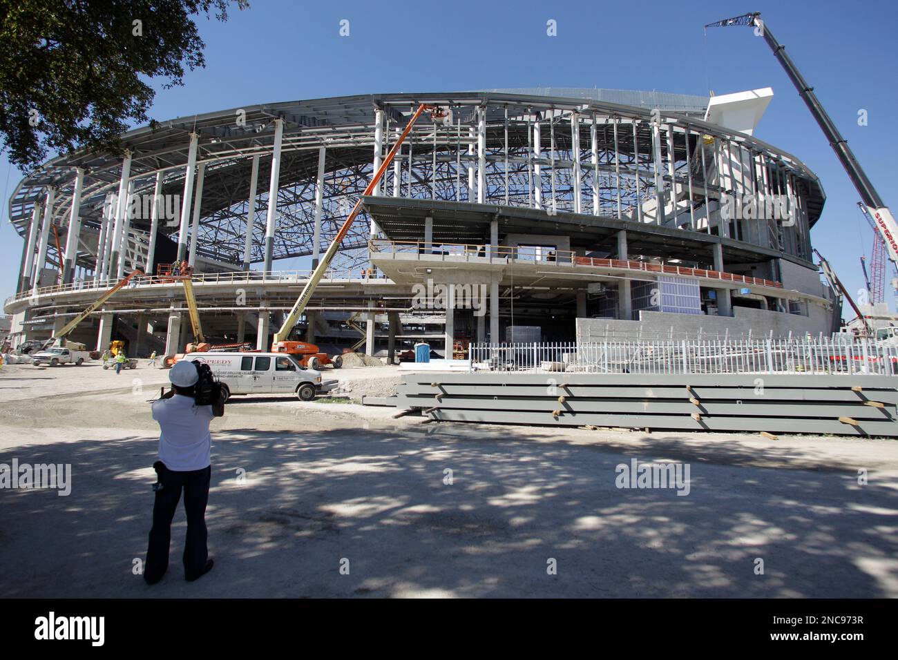 A cameraman takes video of the Florida Marlins new ballpark in MIami ...