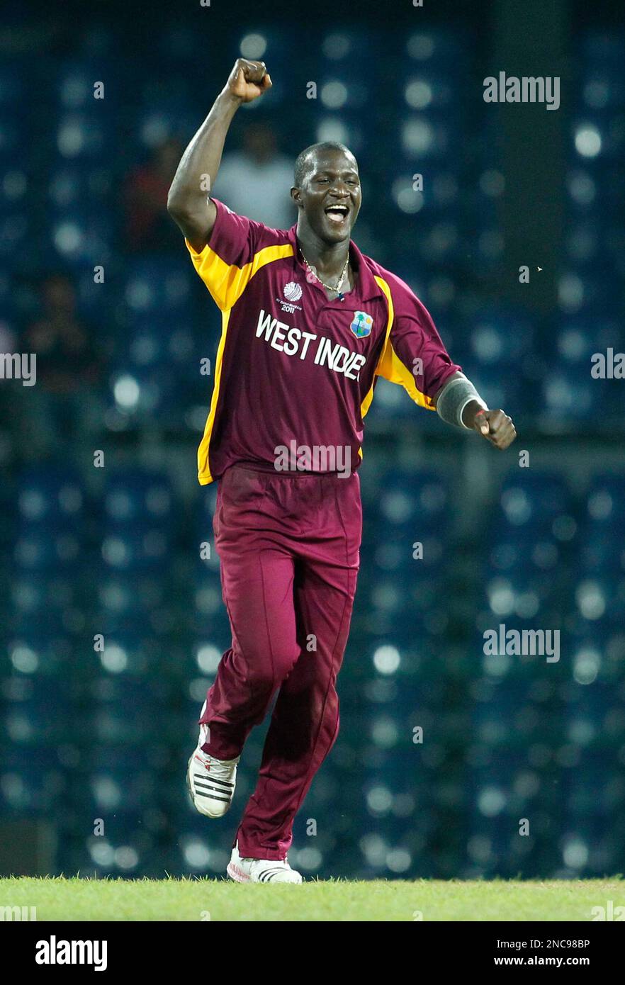 West Indies' cricket captain Darren Sammy celebrates the wicket of Sri ...