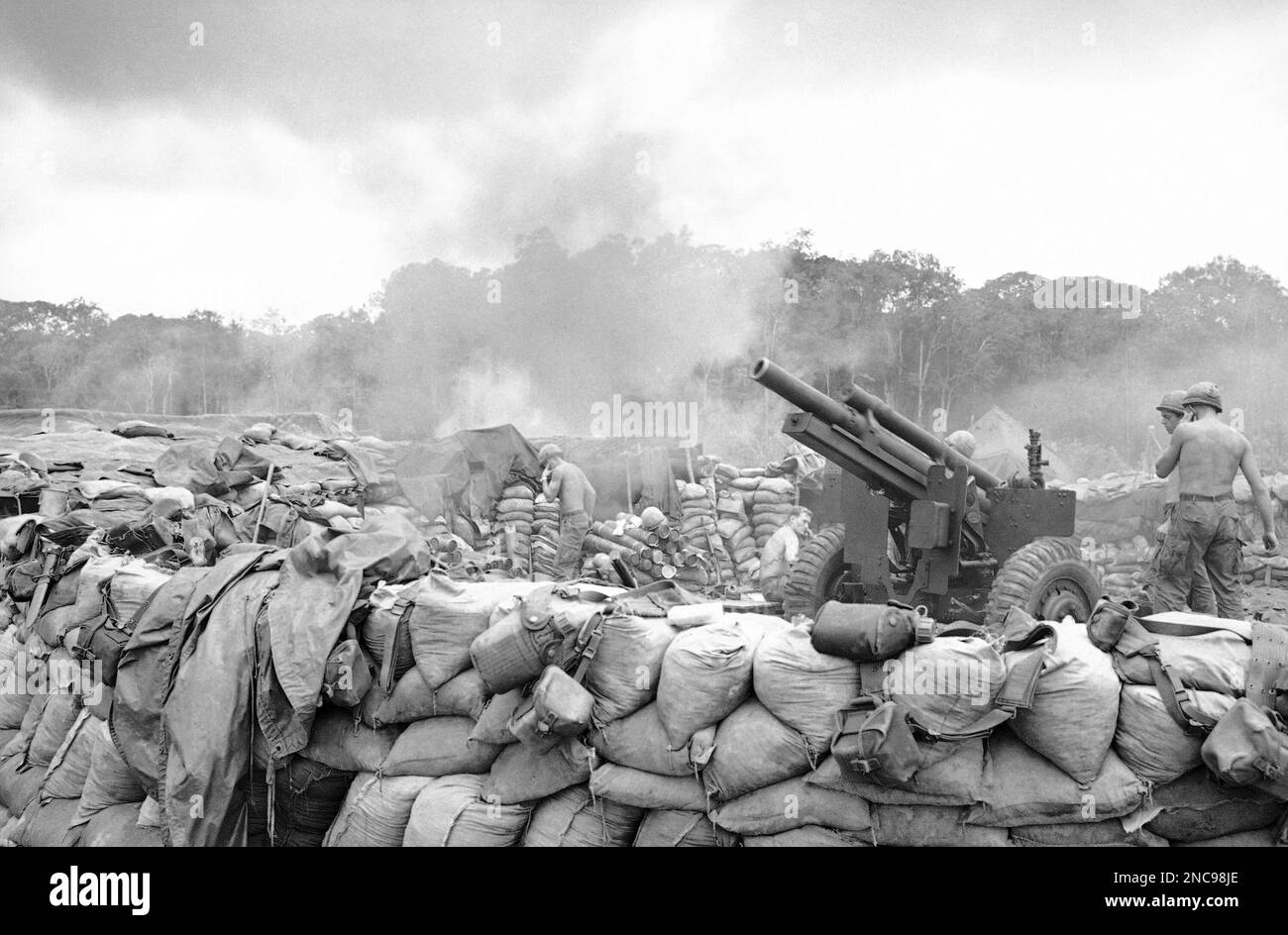 U.S. artillerymen fire 105mm Howitzer rounds in support of a 4th ...