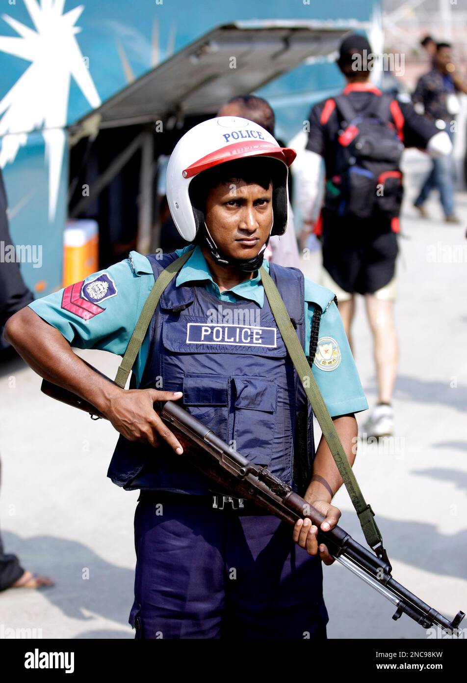 A Bangladeshi police officer takes up position as Canada's cricket team ...