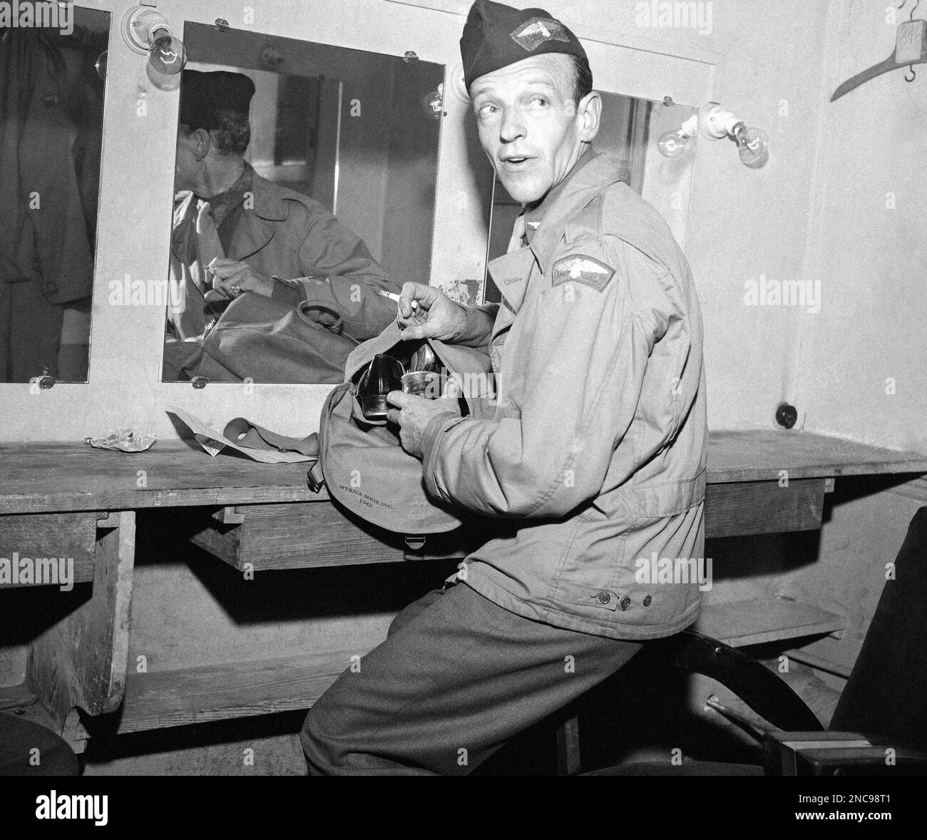 Famed American dancer Fred Astaire is pictured in his dressing room at ...