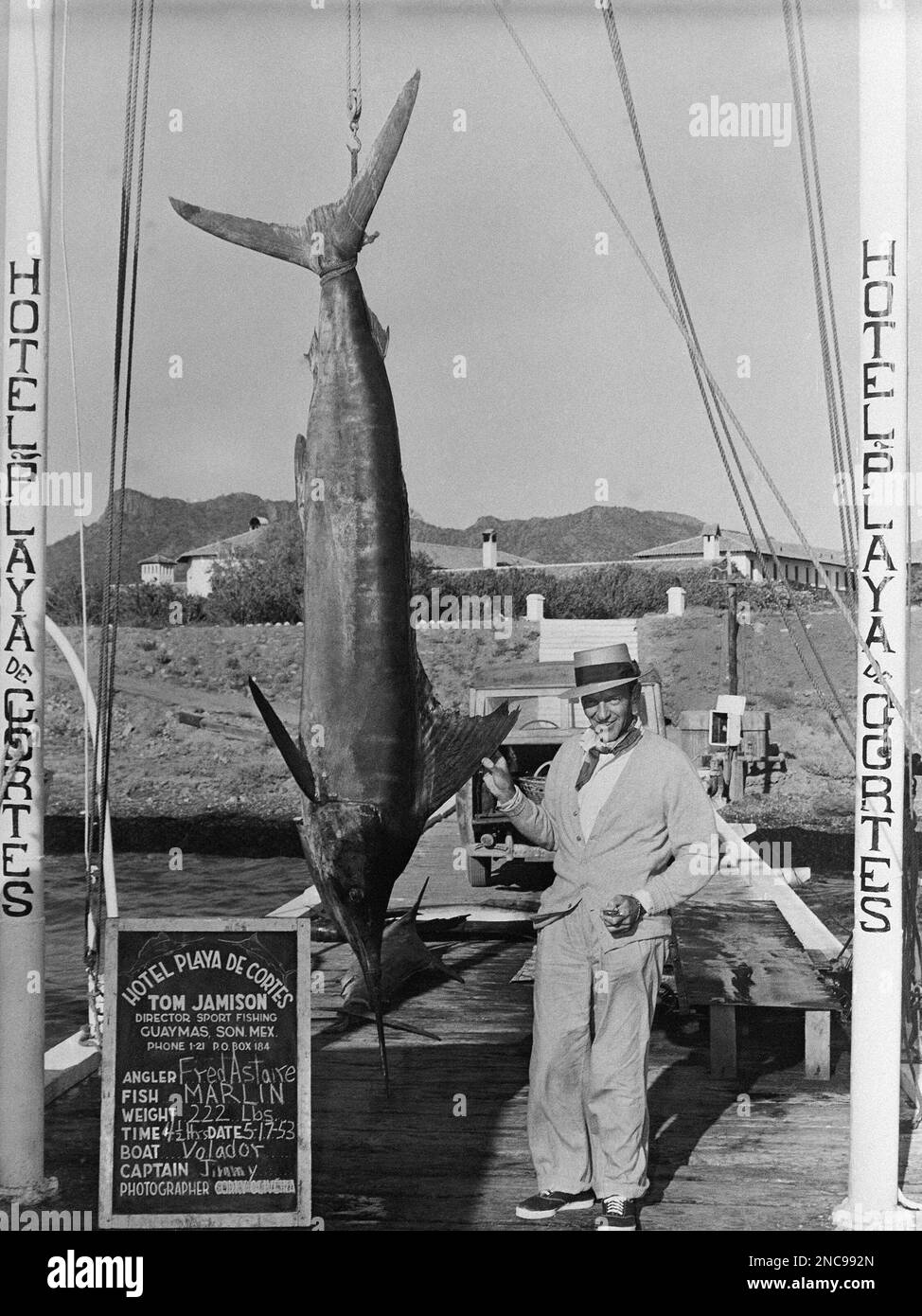 Fred Astaire, film actor, stands beside a 222-pound Marlin on May 25 ...