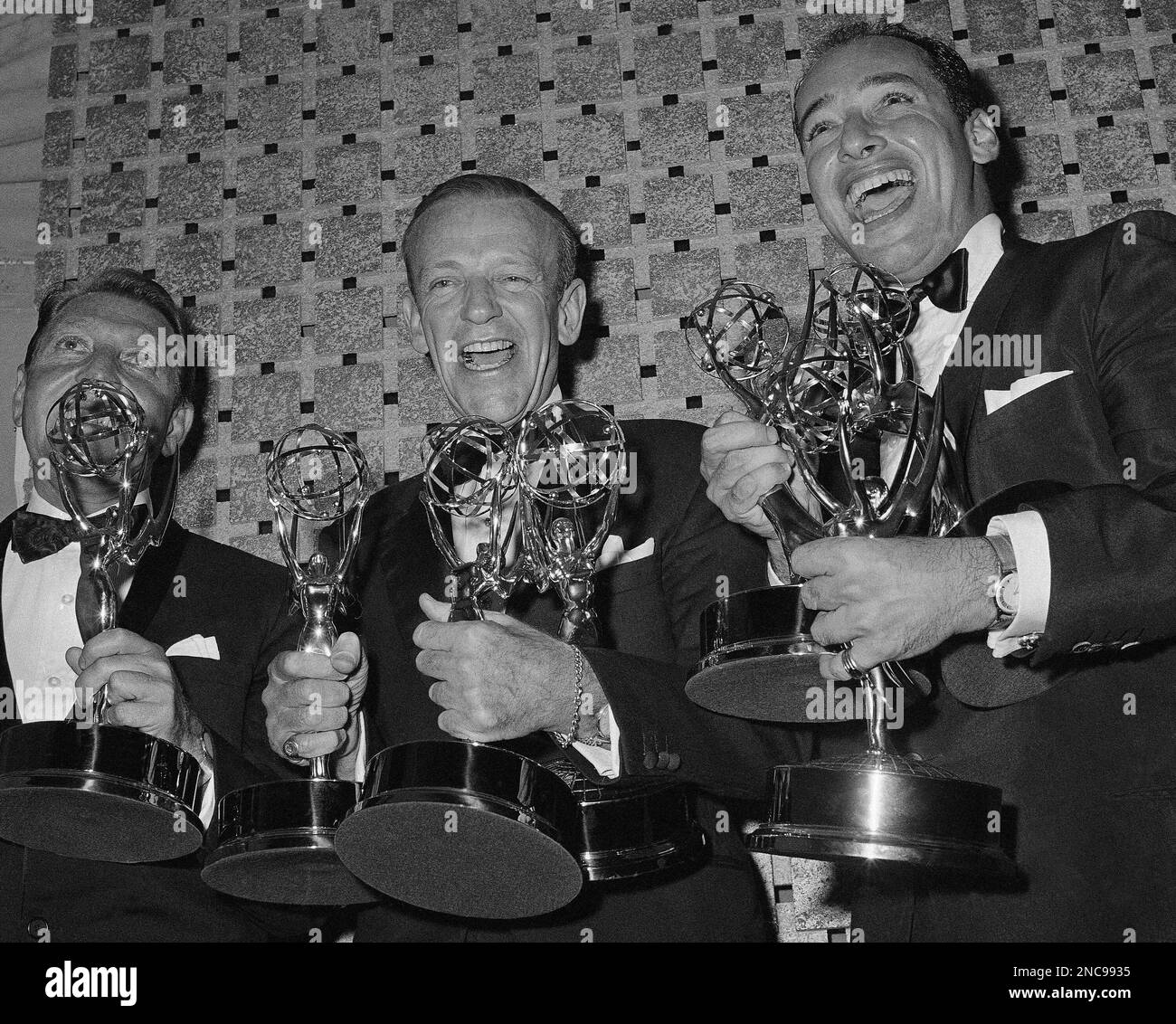 Award ceremony achievement smiling standing looking away holding trophy ...