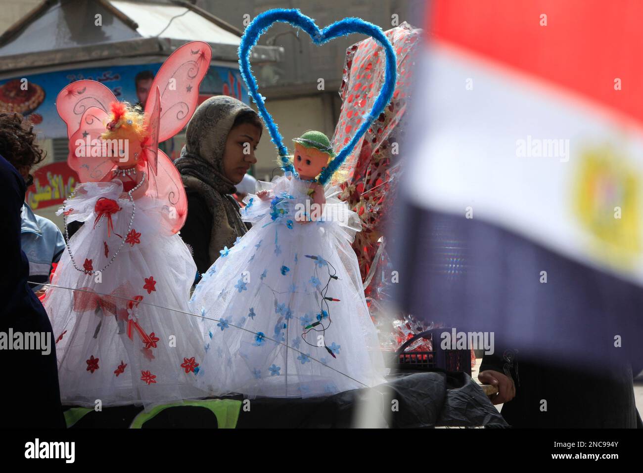 A girl sells traditional dolls of " Mould El Naby " , dolls marking ...