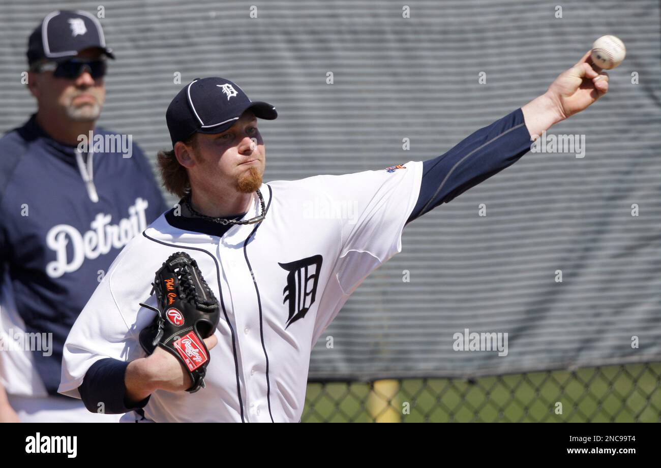 Detroit Tigers relief pitcher Phil Coke throws during a baseball spring ...
