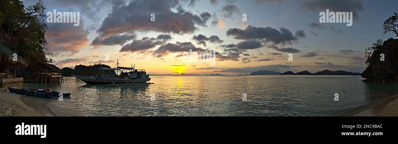 Sunset at a beach on Coron Island Stock Photo - Alamy