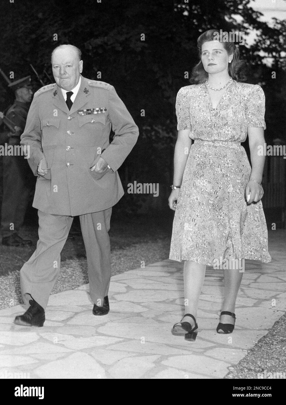 Prime Minister Winston Churchill and his daughter Mary, passing the ...