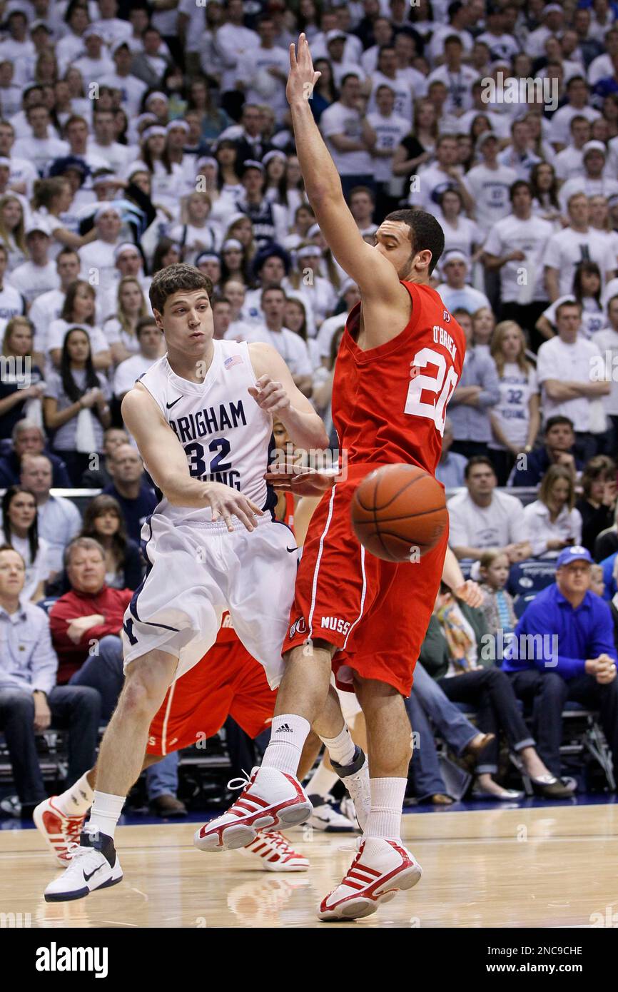 BYU guard Jimmer Fredette (32) passes off the ball as Utah guard J.J. O ...
