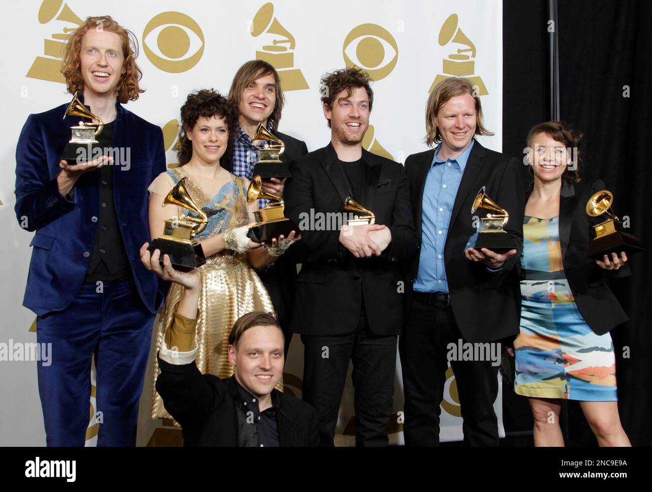 Arcade Fire pose backstage with the award for album of the year at the ...