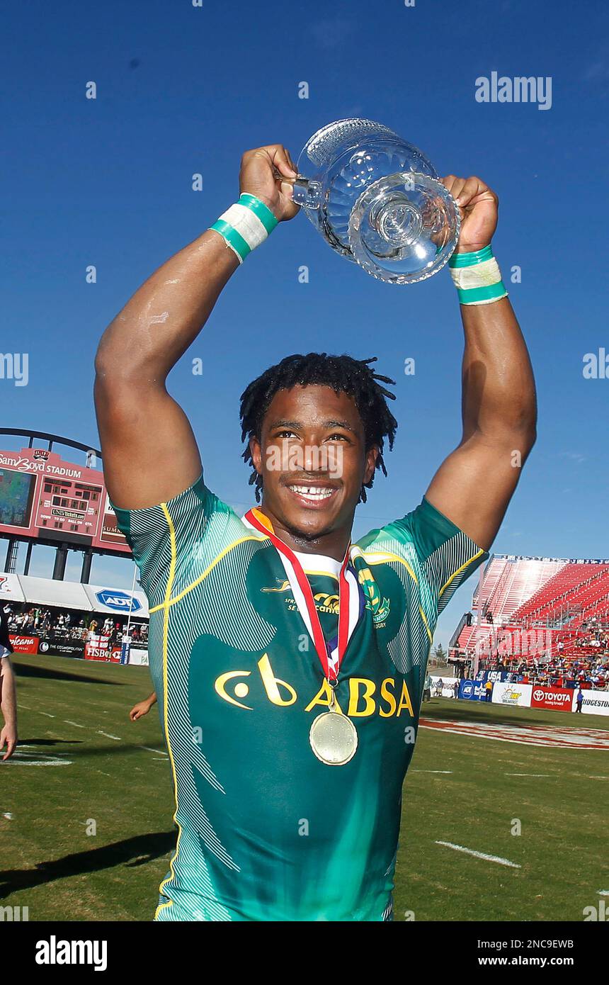 The Republic of South Africa's Cecil Afrika carries the Cup following ...