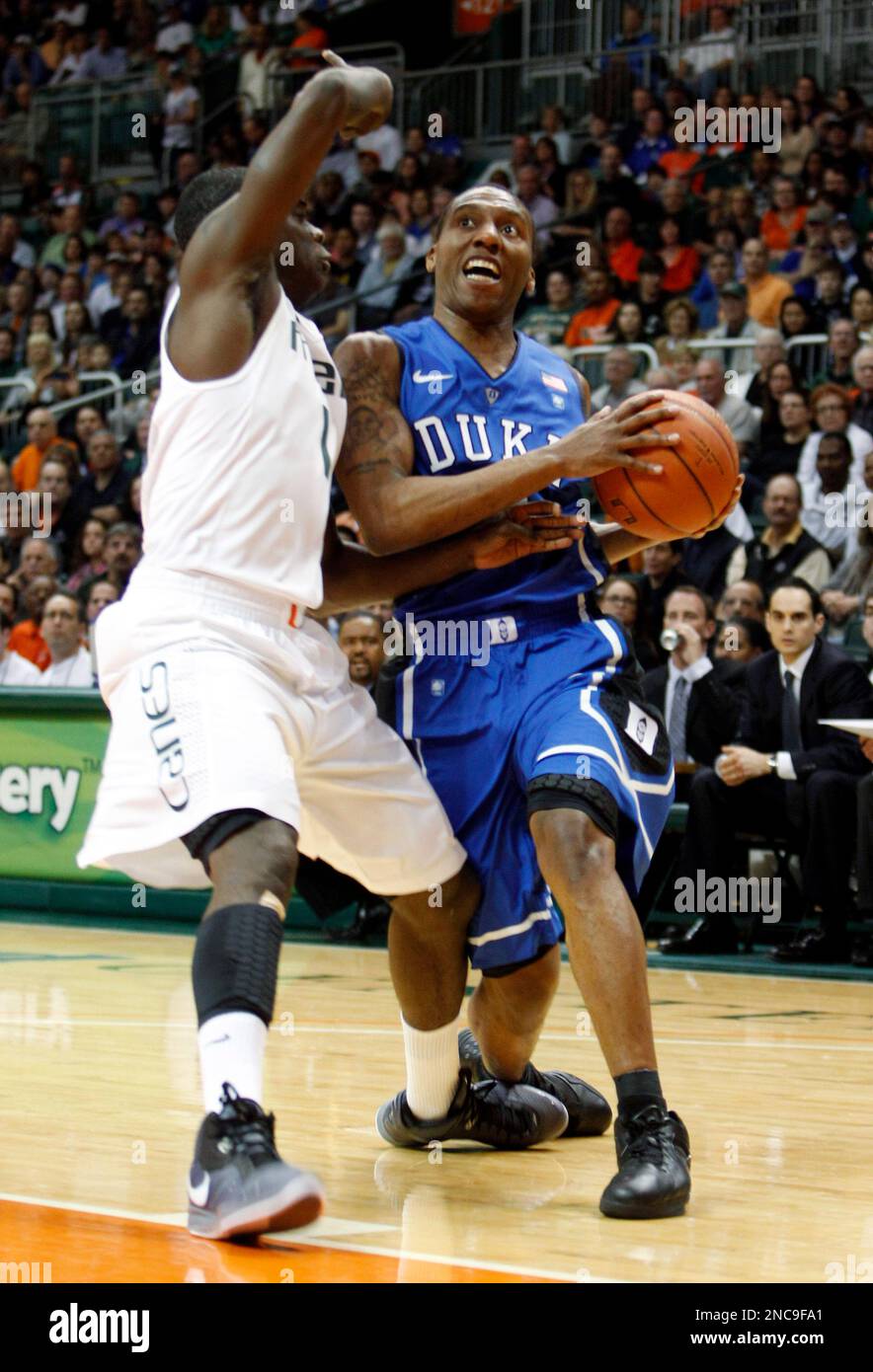 Duke's Nolan Smith, right, drives around Miami's Durand Scott in the ...