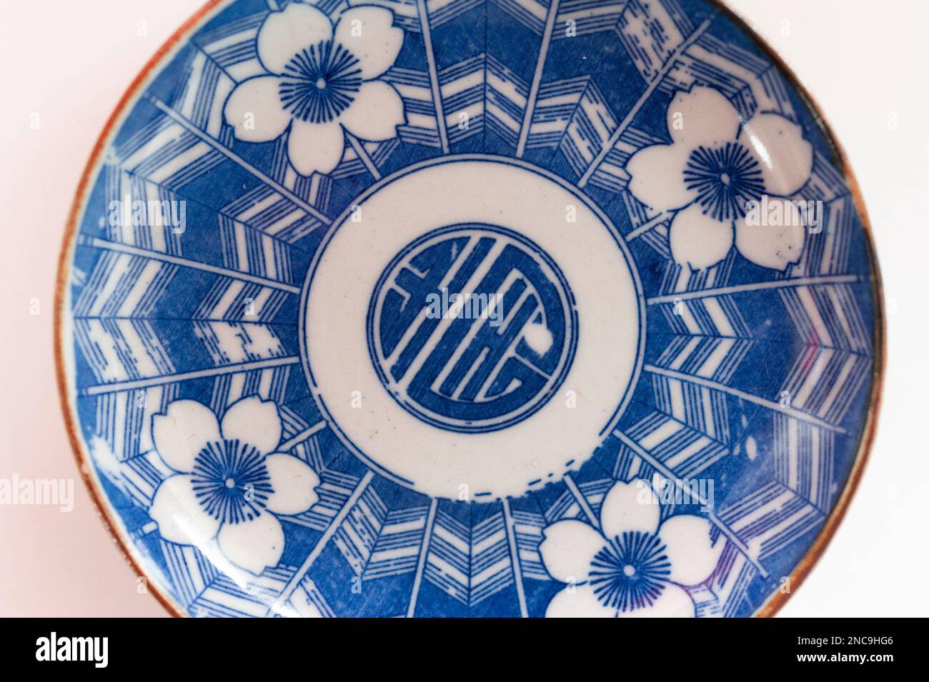 Sakura cherry blossom motif on an antique blue inban Japanese plate ...