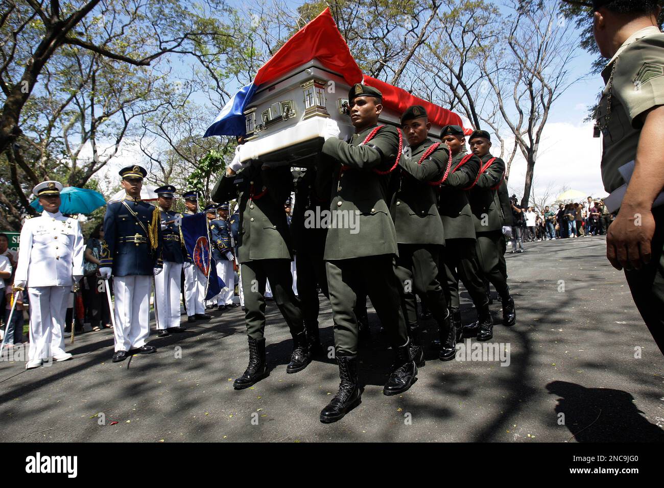 Military pallbearers bring the flag-draped coffin of Ret. Gen. Angelo ...