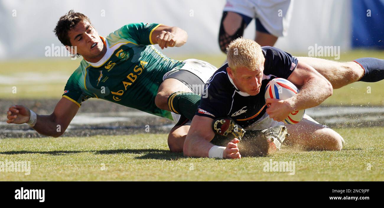 South Africa's Chris Dry brings down Mark Bokhoven, of the United ...