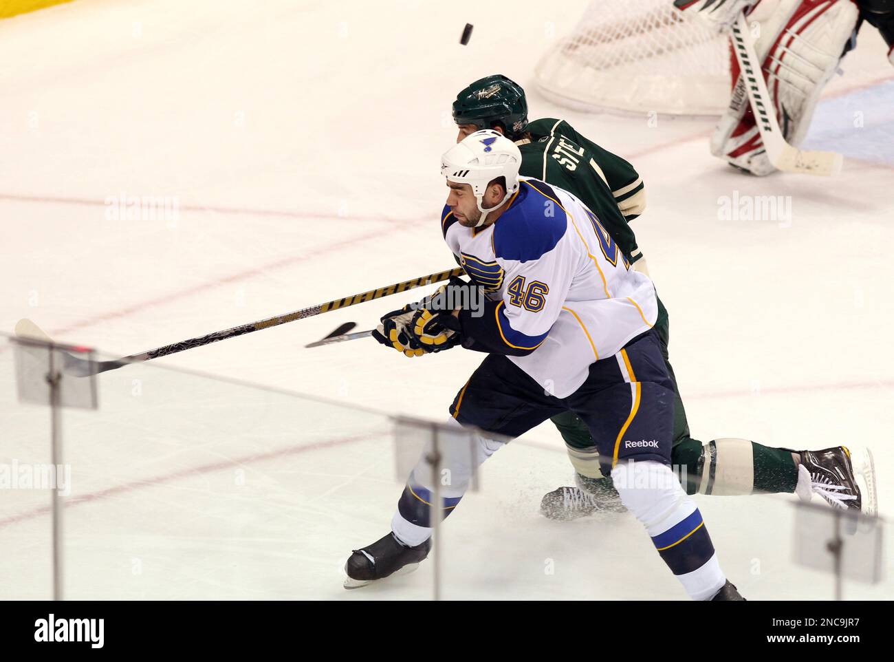 St. Louis Blues' Roman Polak, foreground, collides with Minnesota Wild ...