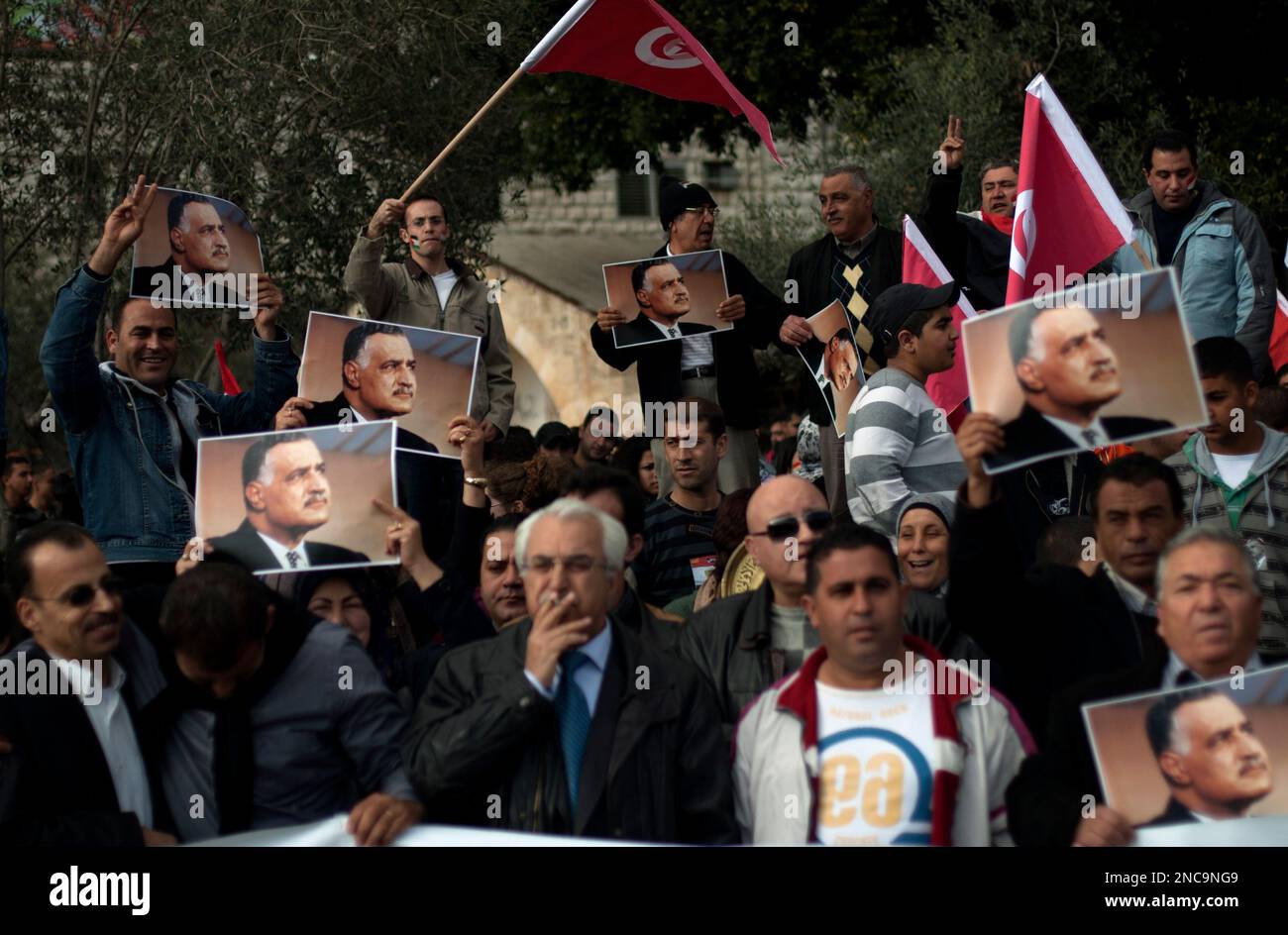Israeli Arabs hold flags and pictures of late Egyptian leader Gamal ...