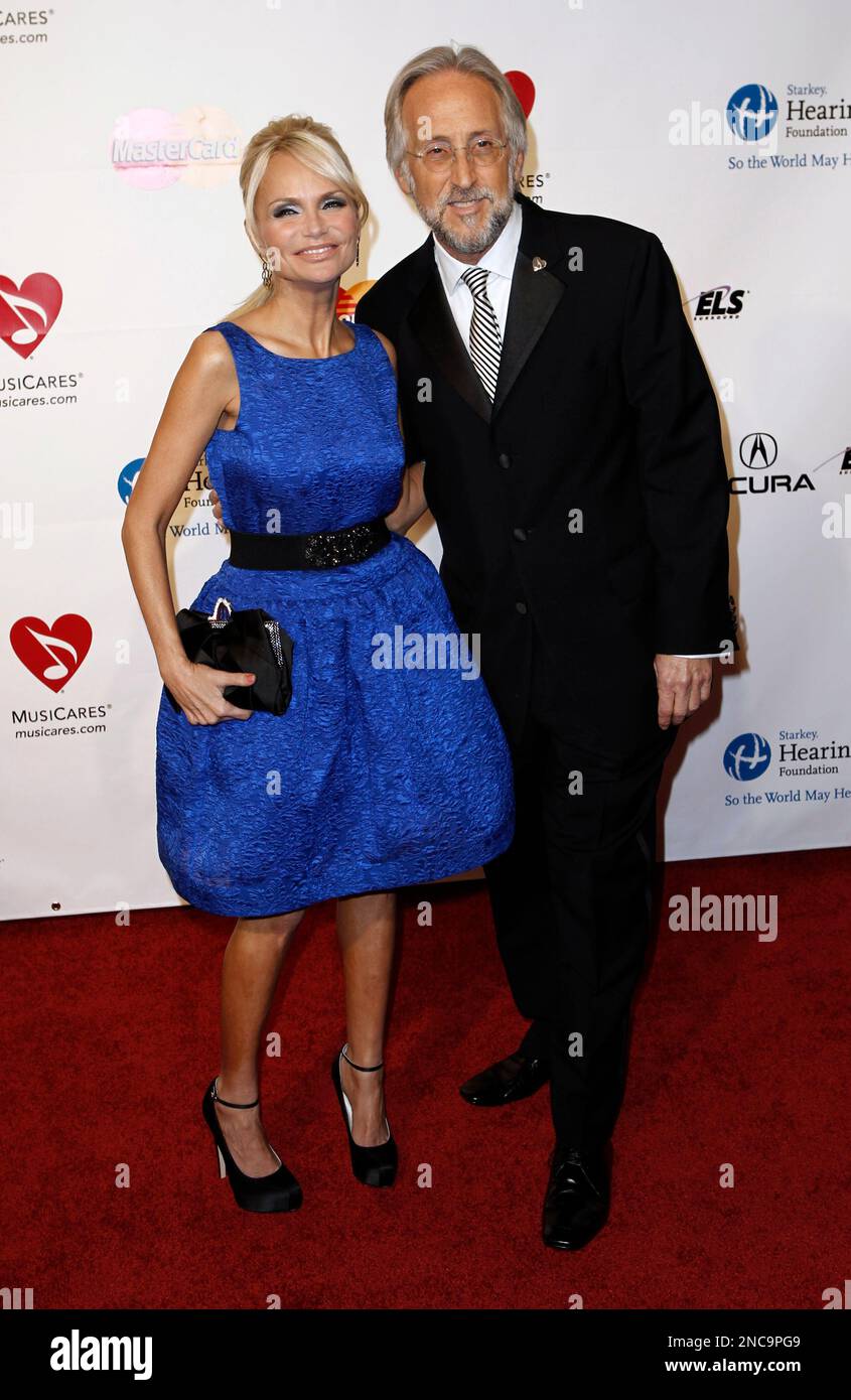 Kristin Chenoweth, left, and Neil Portnow arrive at the MusiCares ...