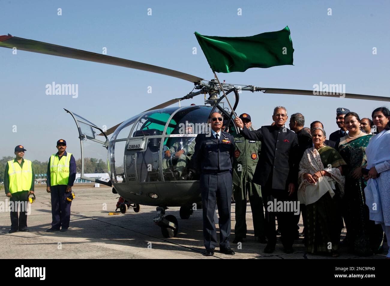 Governor of the north Indian state of Uttar Pradesh B.L. Joshi flags ...