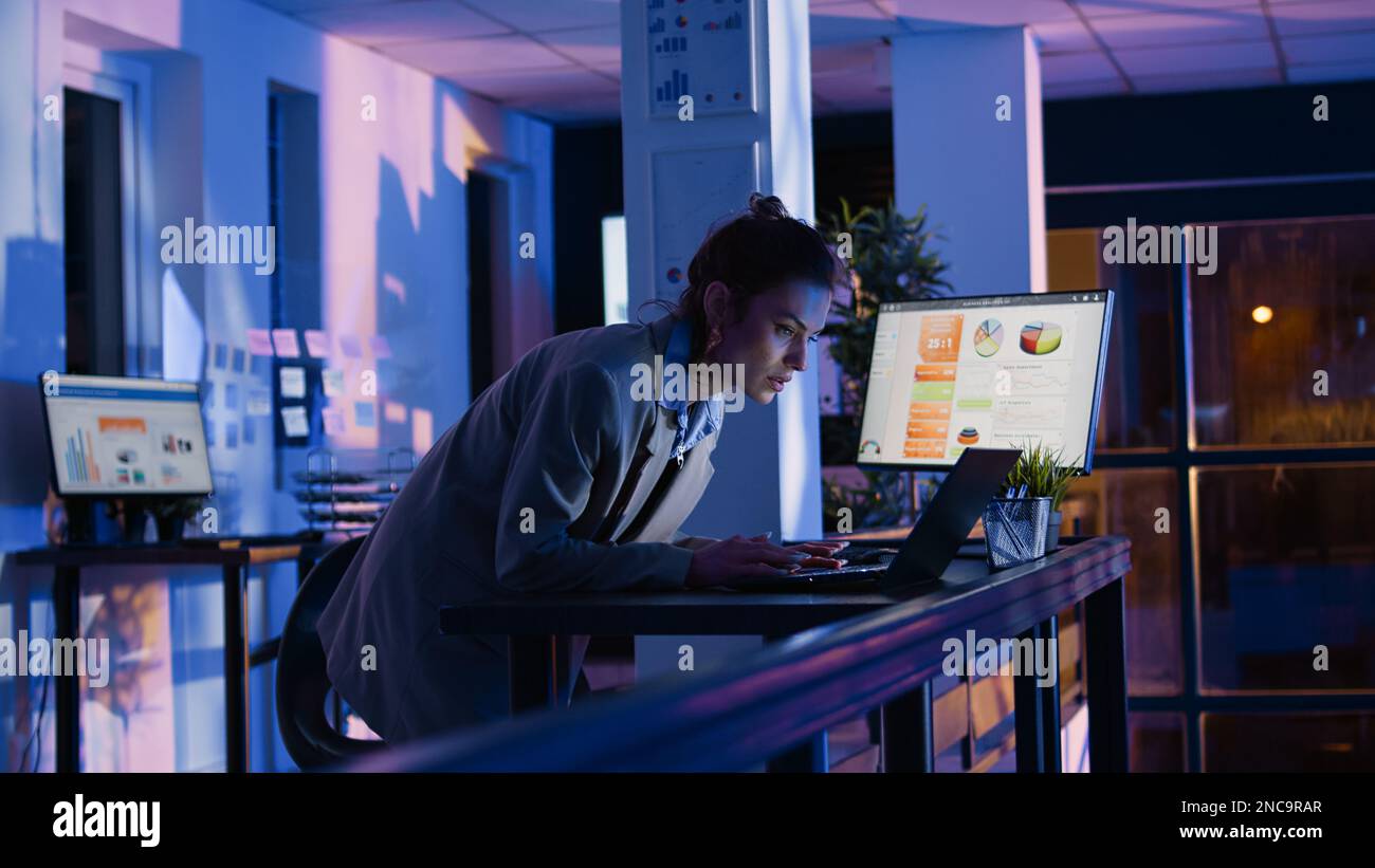 Corporate worker checking graphs on monitors planning financial ...