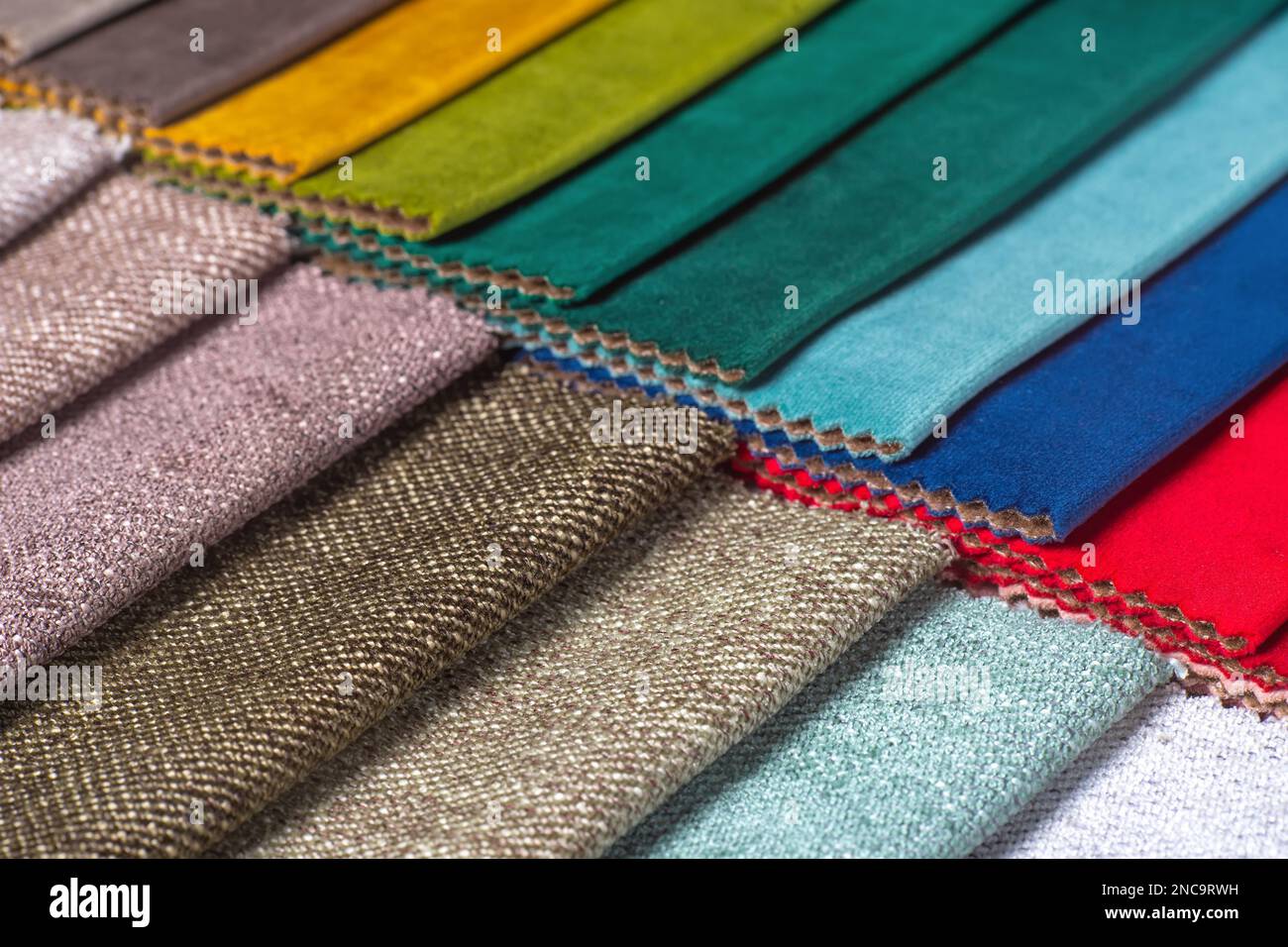 Bright collection of colorful textile samples. Fabric swatches, set in ...