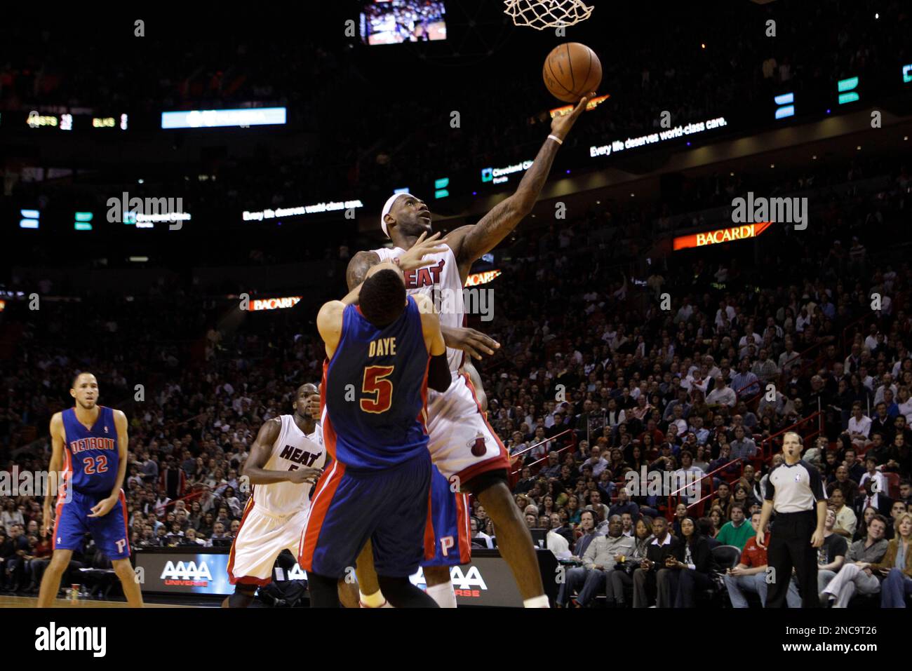 Miami Heat's LeBron James (6) shoots and is fouled by Detroit Pistons ...