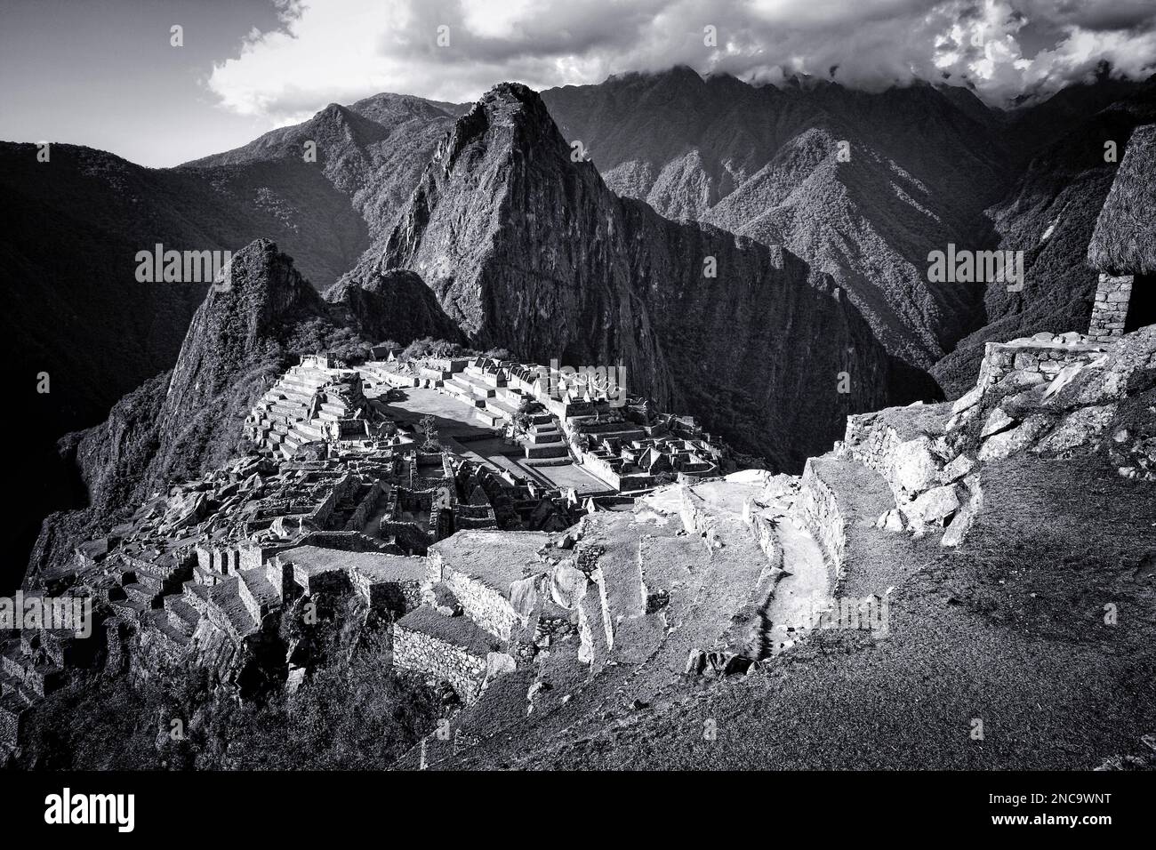 The historic Inca city ruins of Machu Picchu sprawl across a high ...