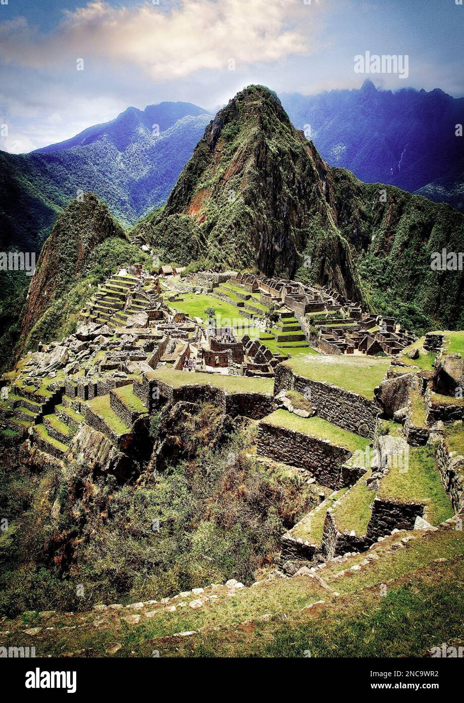 The historic Inca city ruins of Machu Picchu sprawl across a high ...