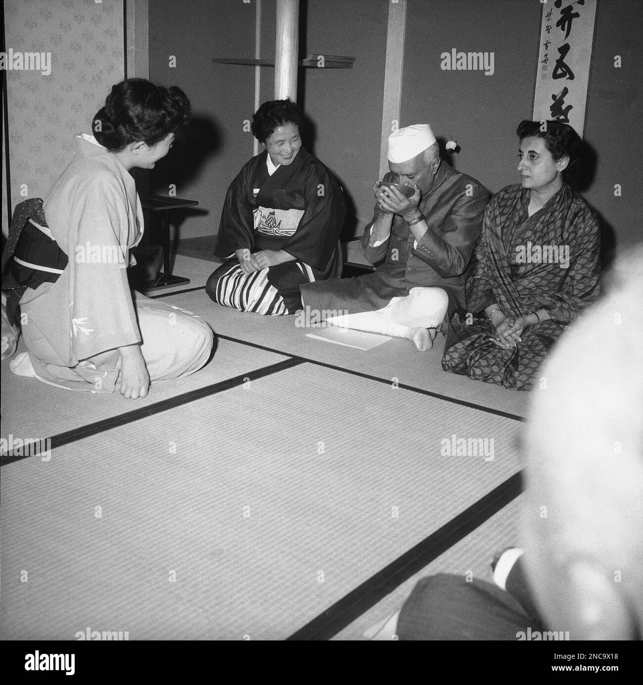Indian Prime Minister Jawaharlal Nehru sips tea Japanese style at a ...