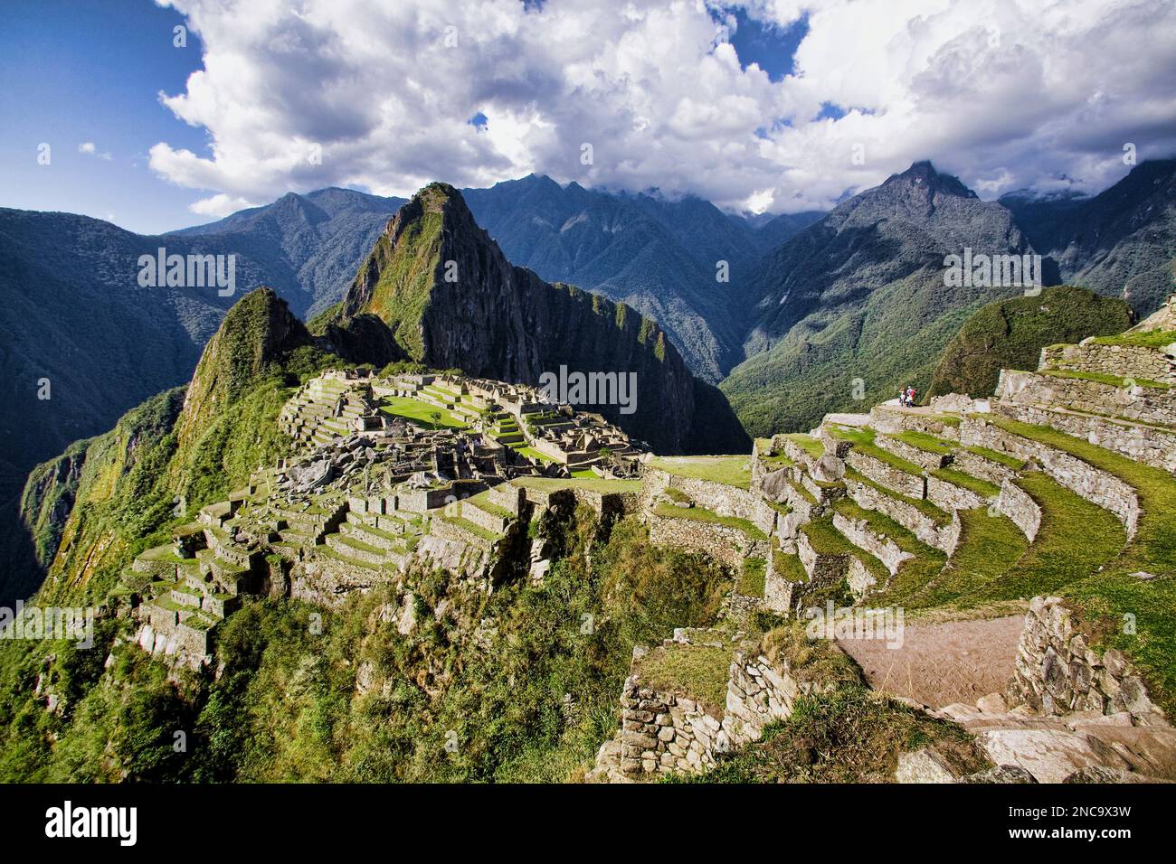The historic Inca city ruins of Machu Picchu sprawl across a high ...
