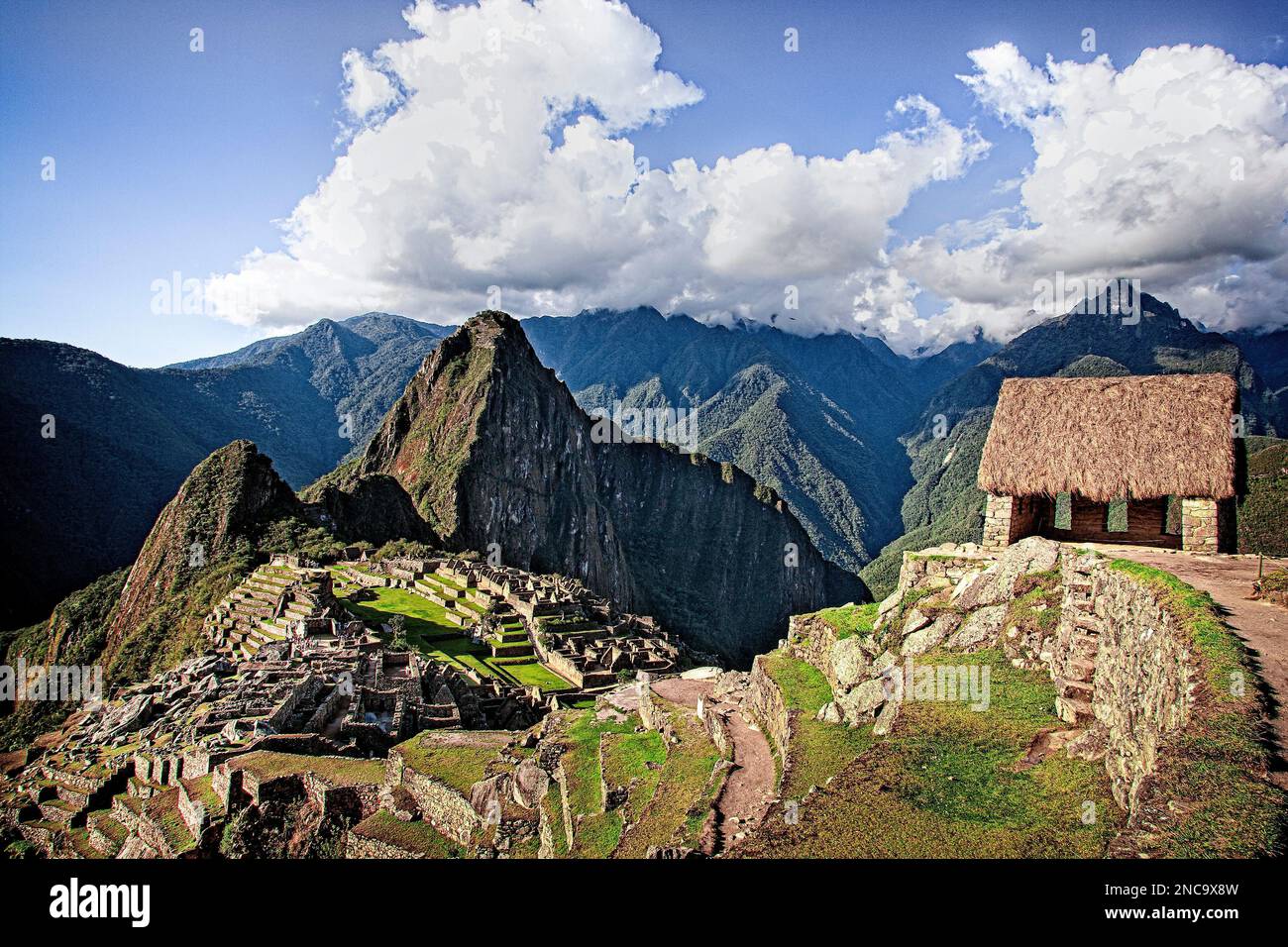 The guard house overlooks the ancient Incan ruins of Machu Picchu, Peru ...