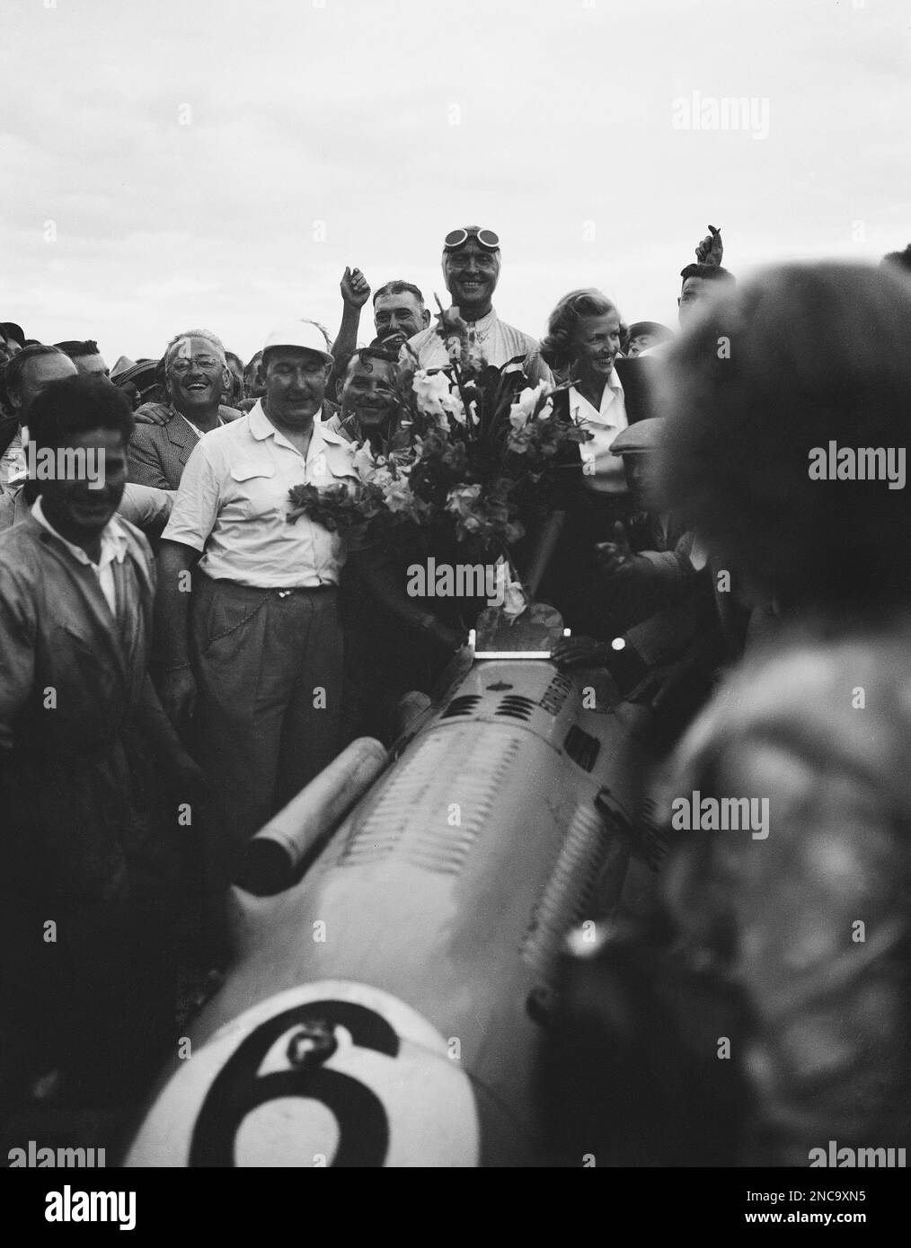 Louis Chiron (center with goggles) after his win in the French Grand ...