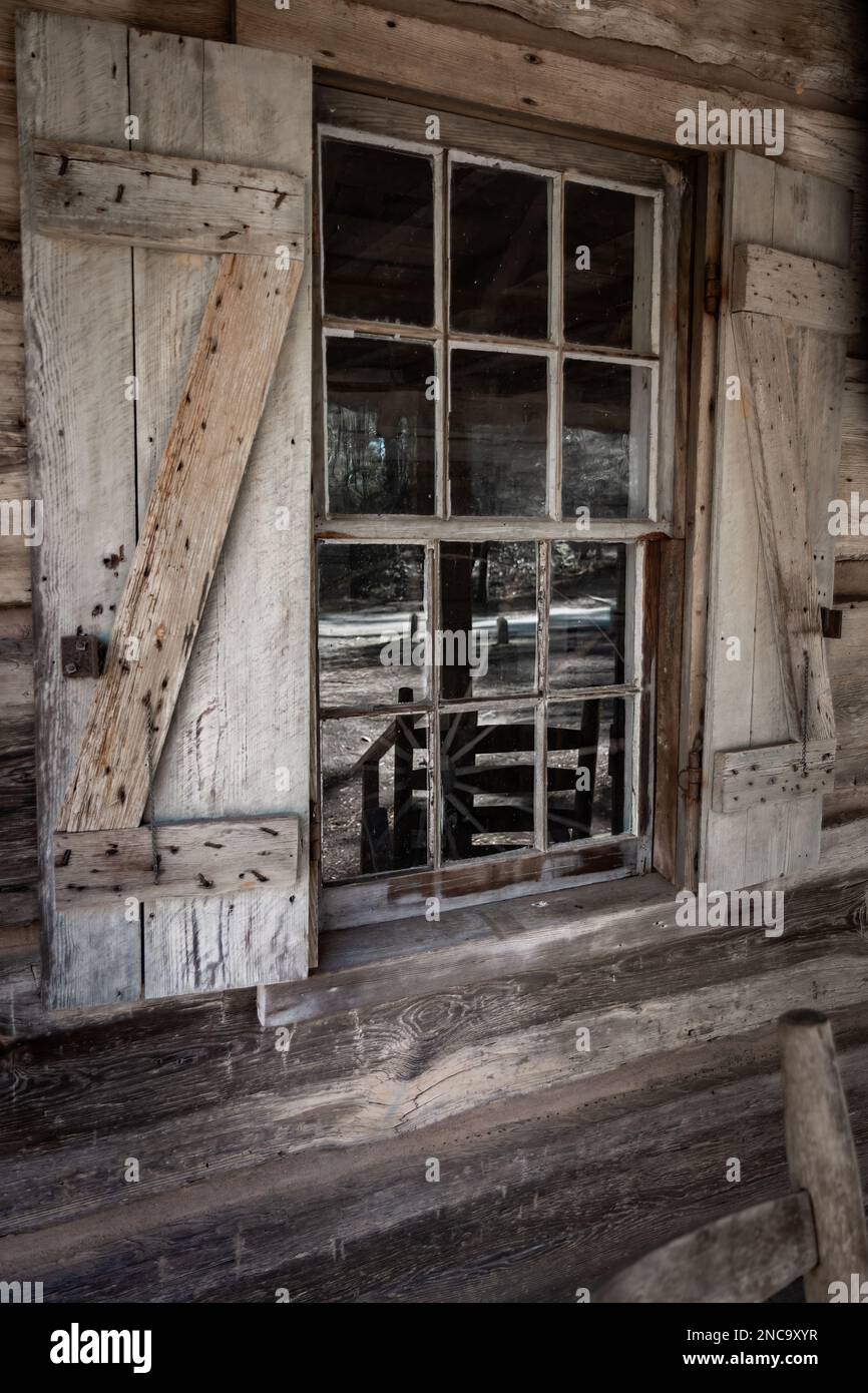 A closeup of windowpanes and shutters from civil war era 1800s log ...