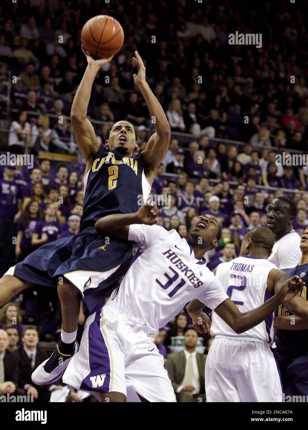 California's Jorge Gutierrez (2) shoots over Washington's Terrence Ross ...