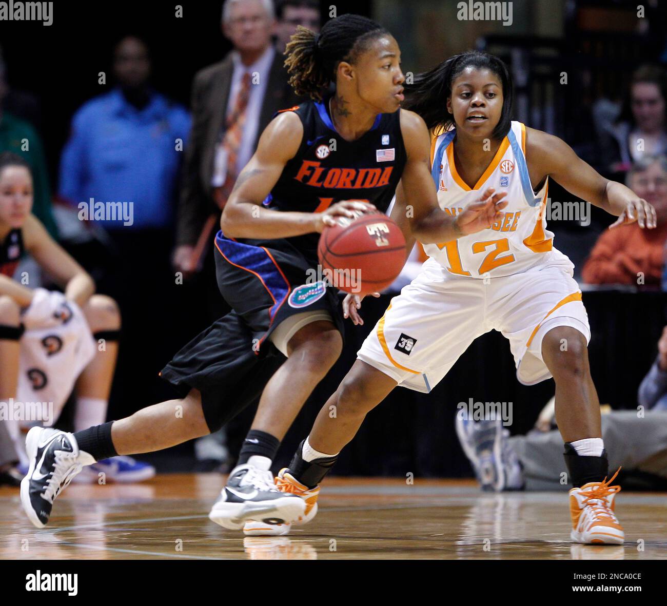 Florida's Deana Allen, left, drives against Tennessee's Lauren Avant ...