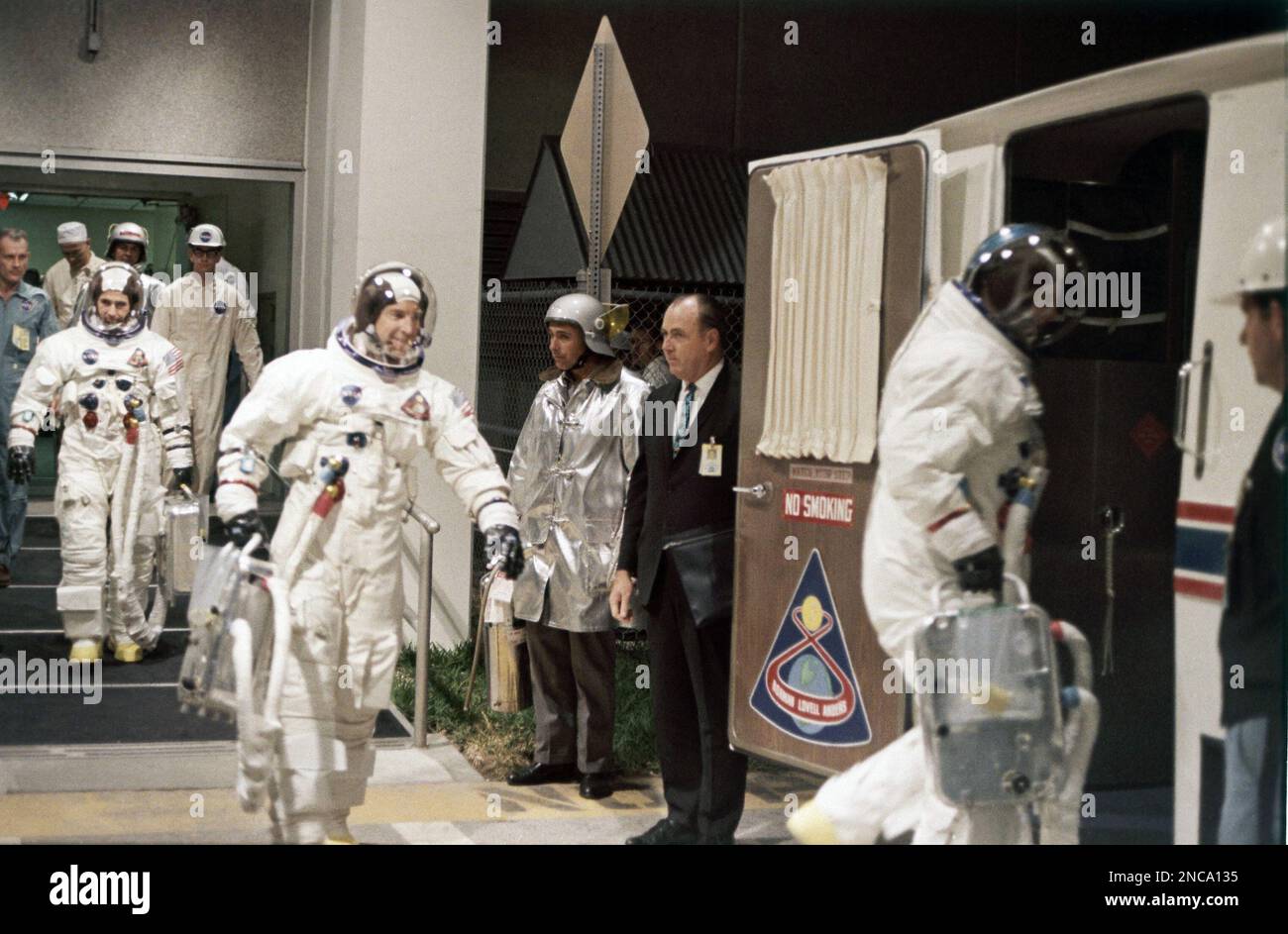 Apollo 8 Commander Frank Borman steps into transfer van which transported him and James Lovell ...