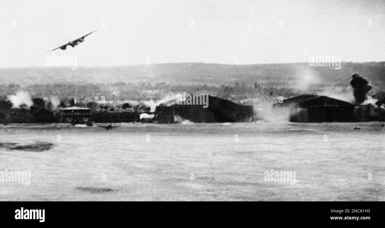 An RAF Mosquito bomber flies away after dropping its bombs on an enemy ...